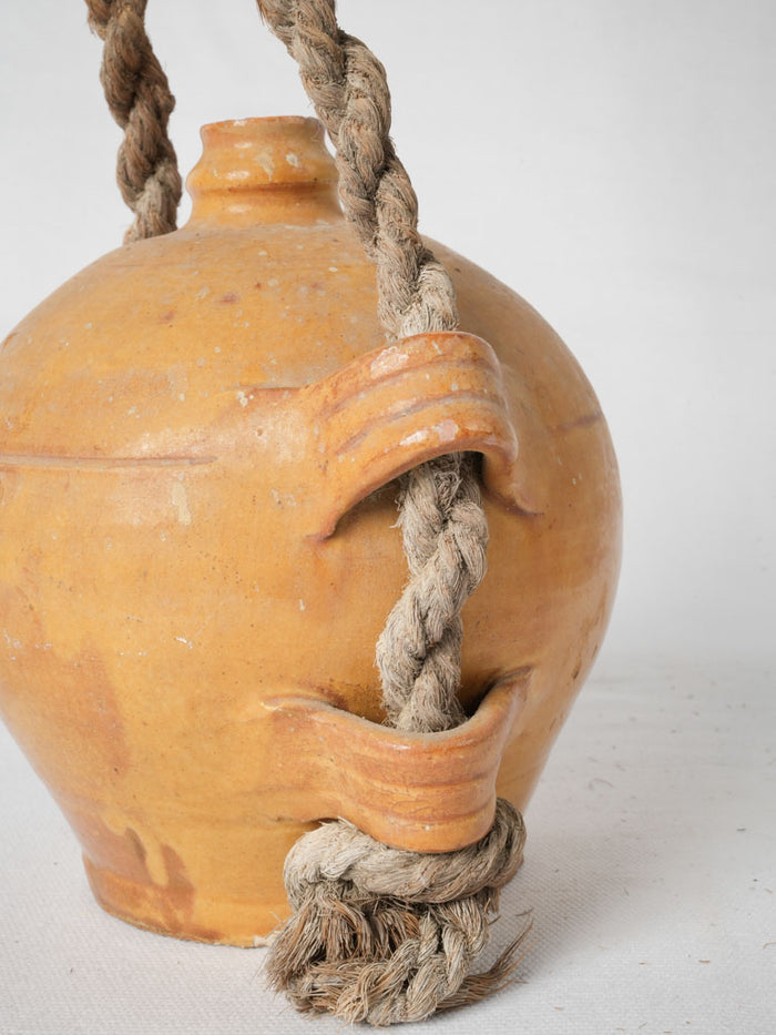 Petit 1950s 'conscience' water jug - yellow w/ rope