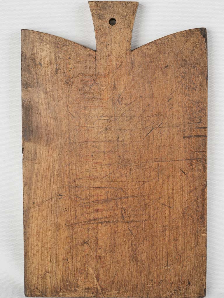 Vintage French cutting board w/ rounded shoulders & flared handle 14½"