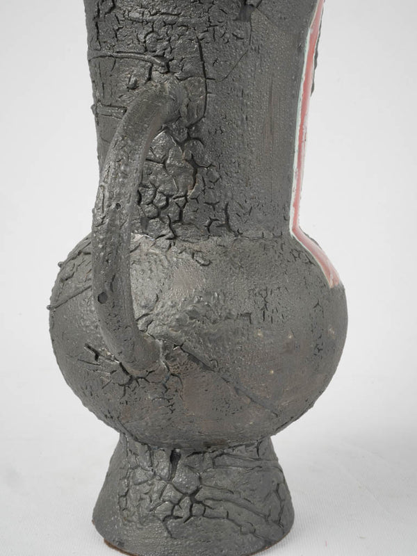 Large French volcanic black ceramic pitcher w/ red-glazed woodpecker d