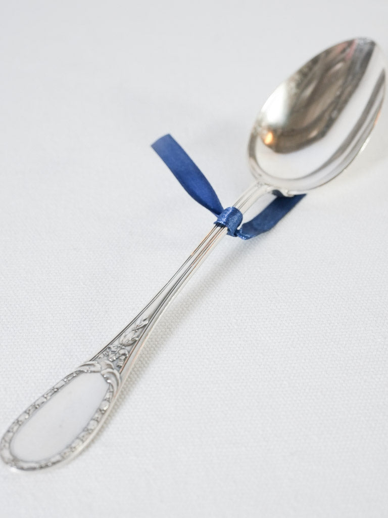 Pretty serving spoon w/ floral trophy