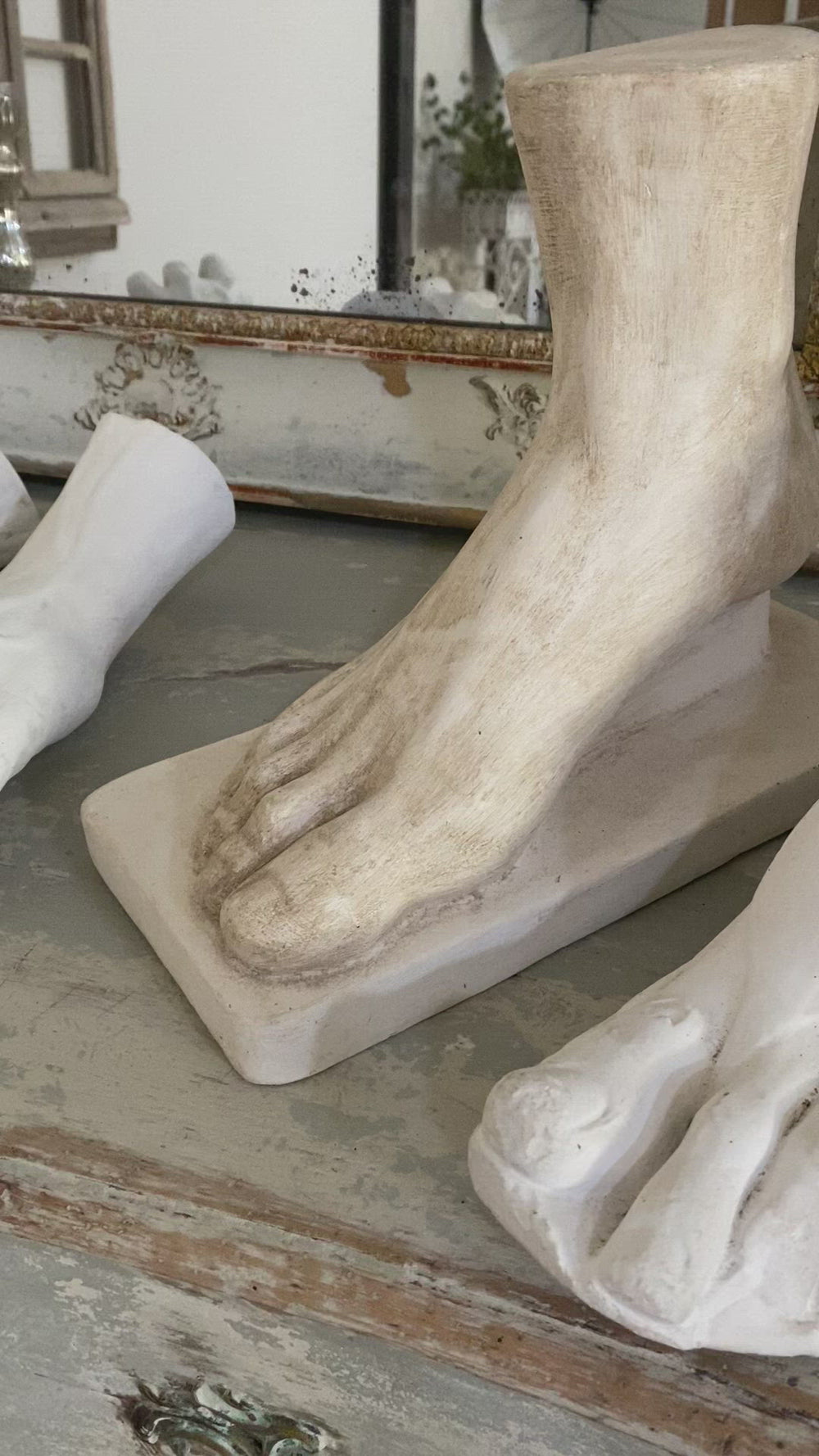 Vintage plaster foot sculpture mounted on a rectangular base