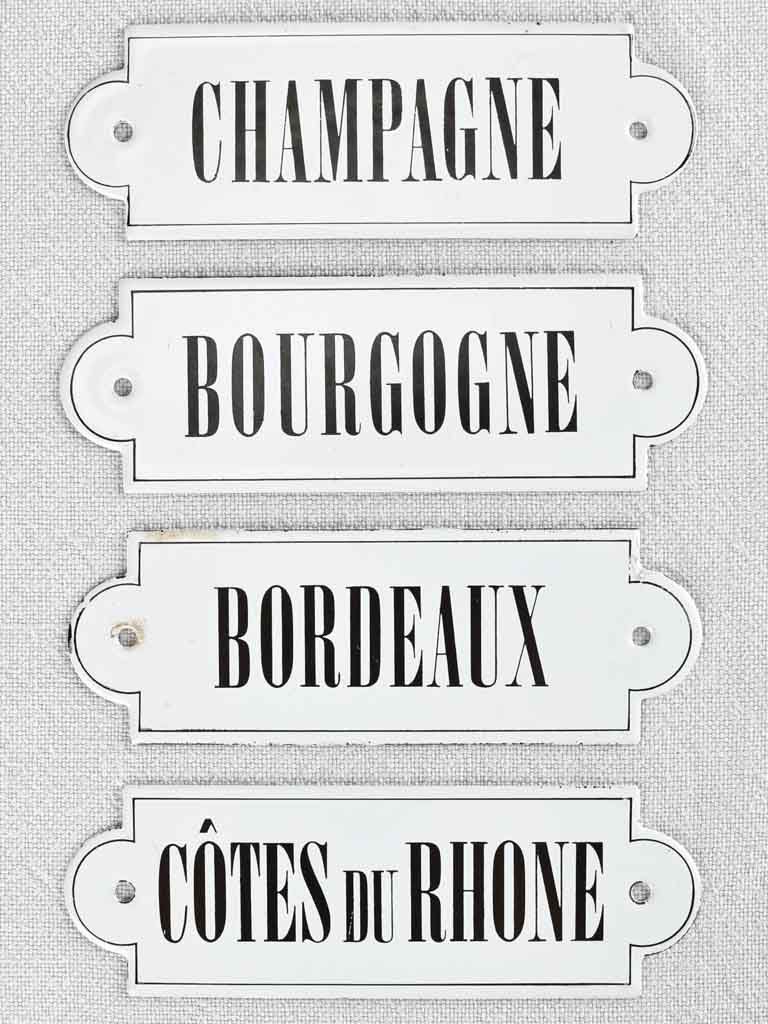Collection of four enamel French wine appellation labels