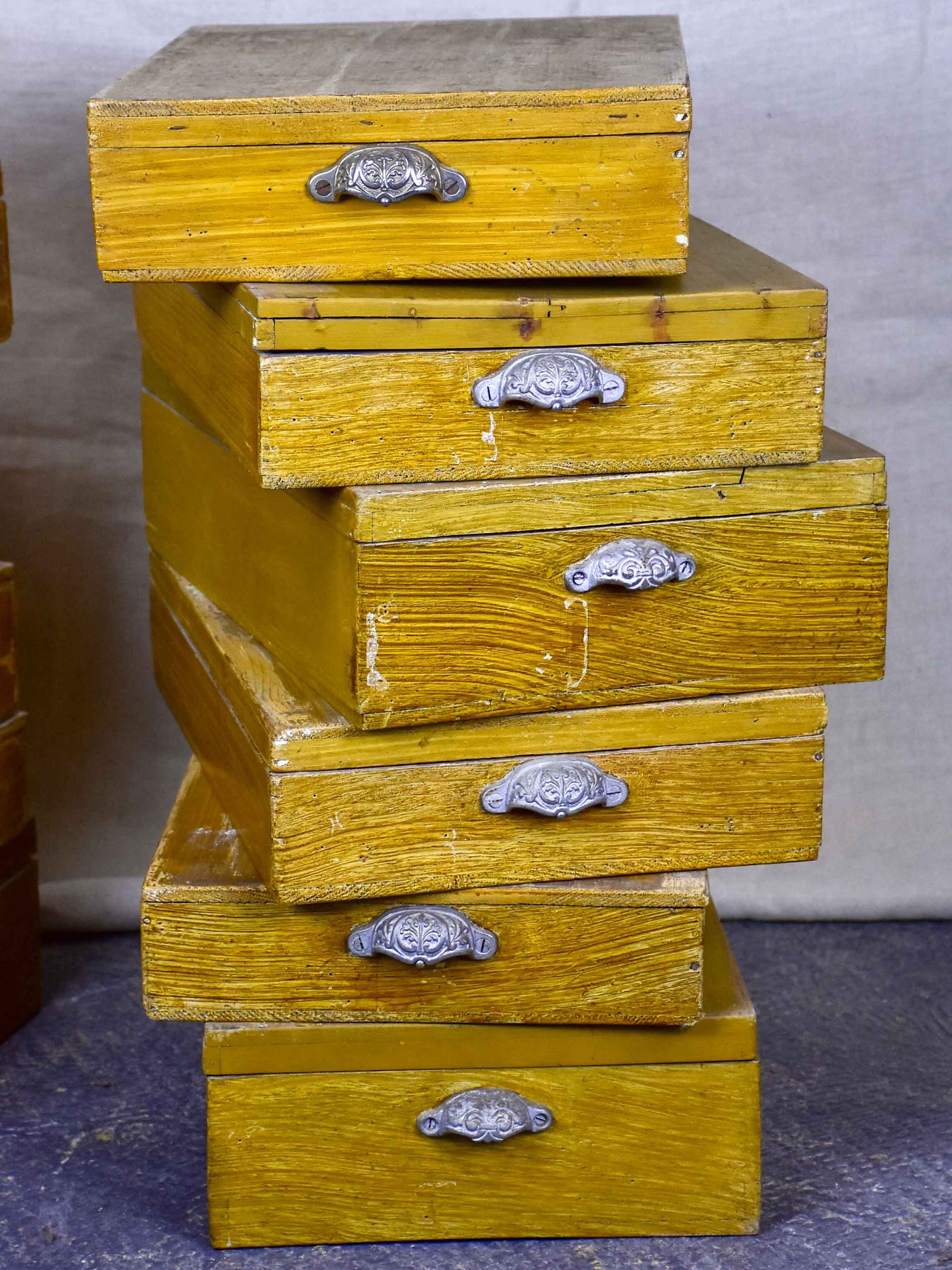 Set of twelve antique French boxes from a glove shop