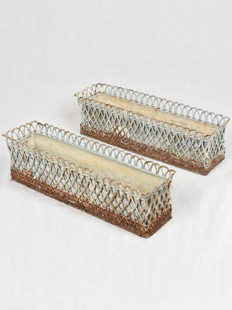 Pair of 19th century wrought iron window planters with rustic blue pat