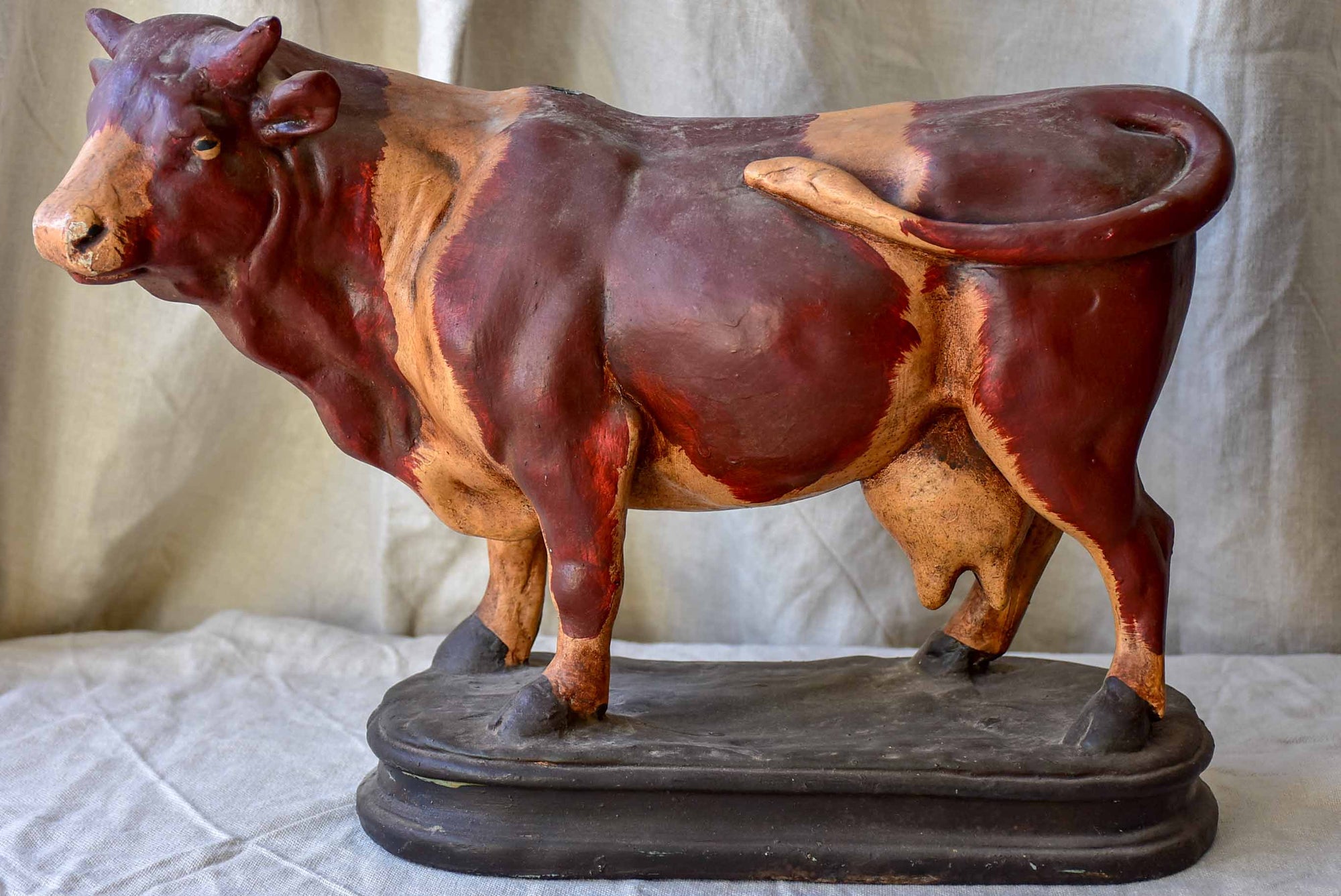 Pair of cow sculptures from a butcher's shop
