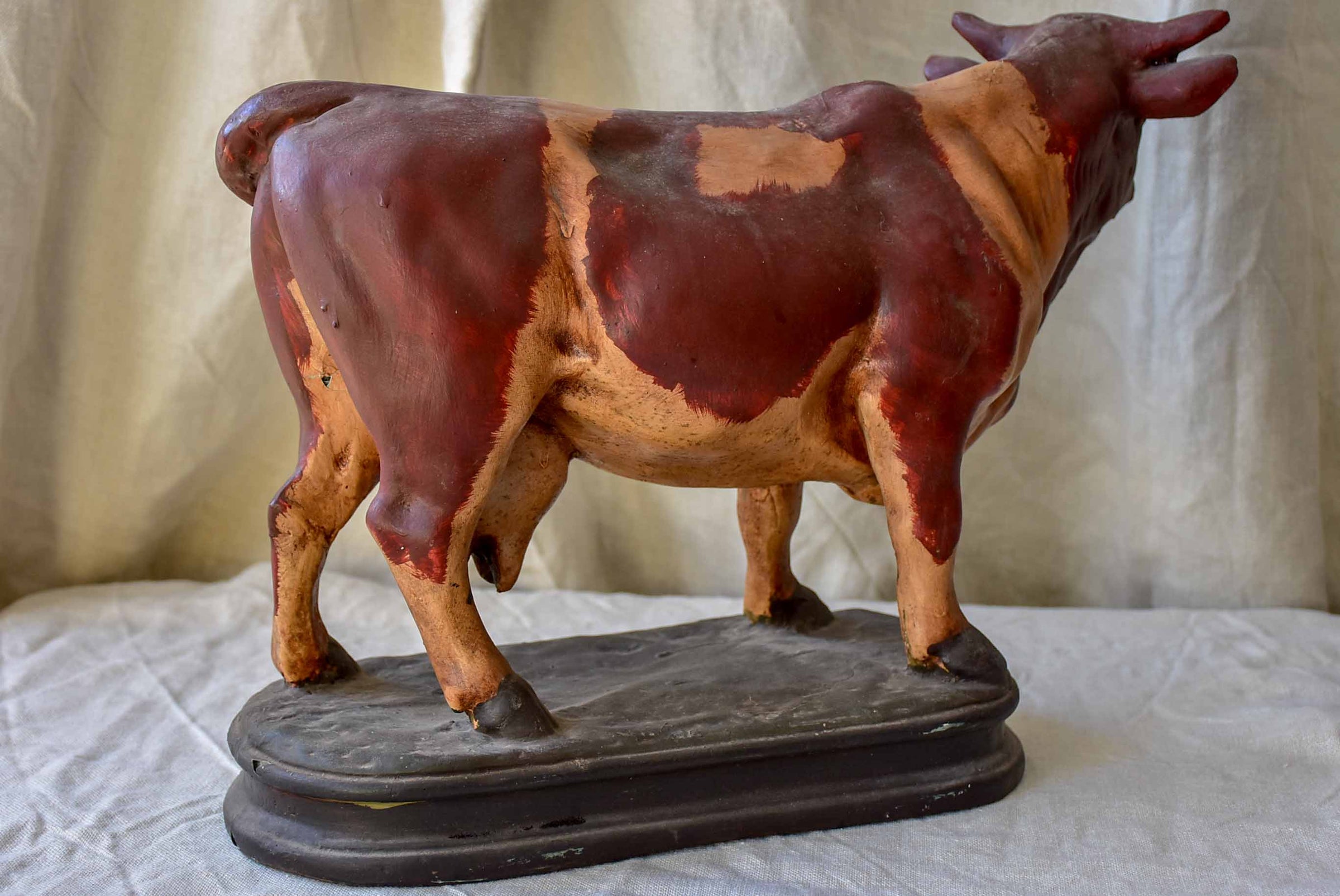 Pair of cow sculptures from a butcher's shop