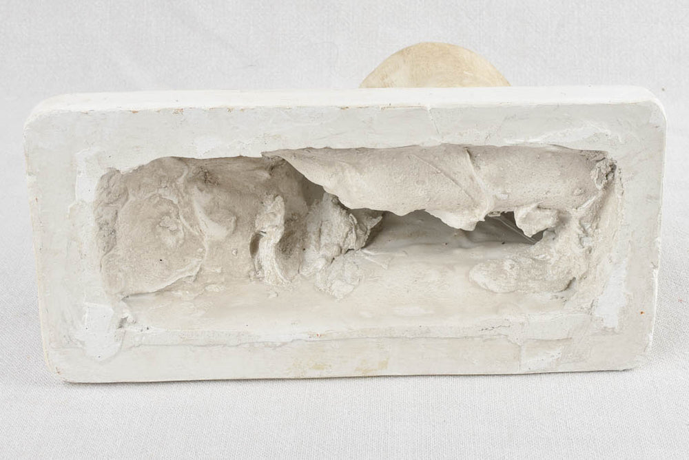 Vintage plaster foot sculpture mounted on a rectangular base