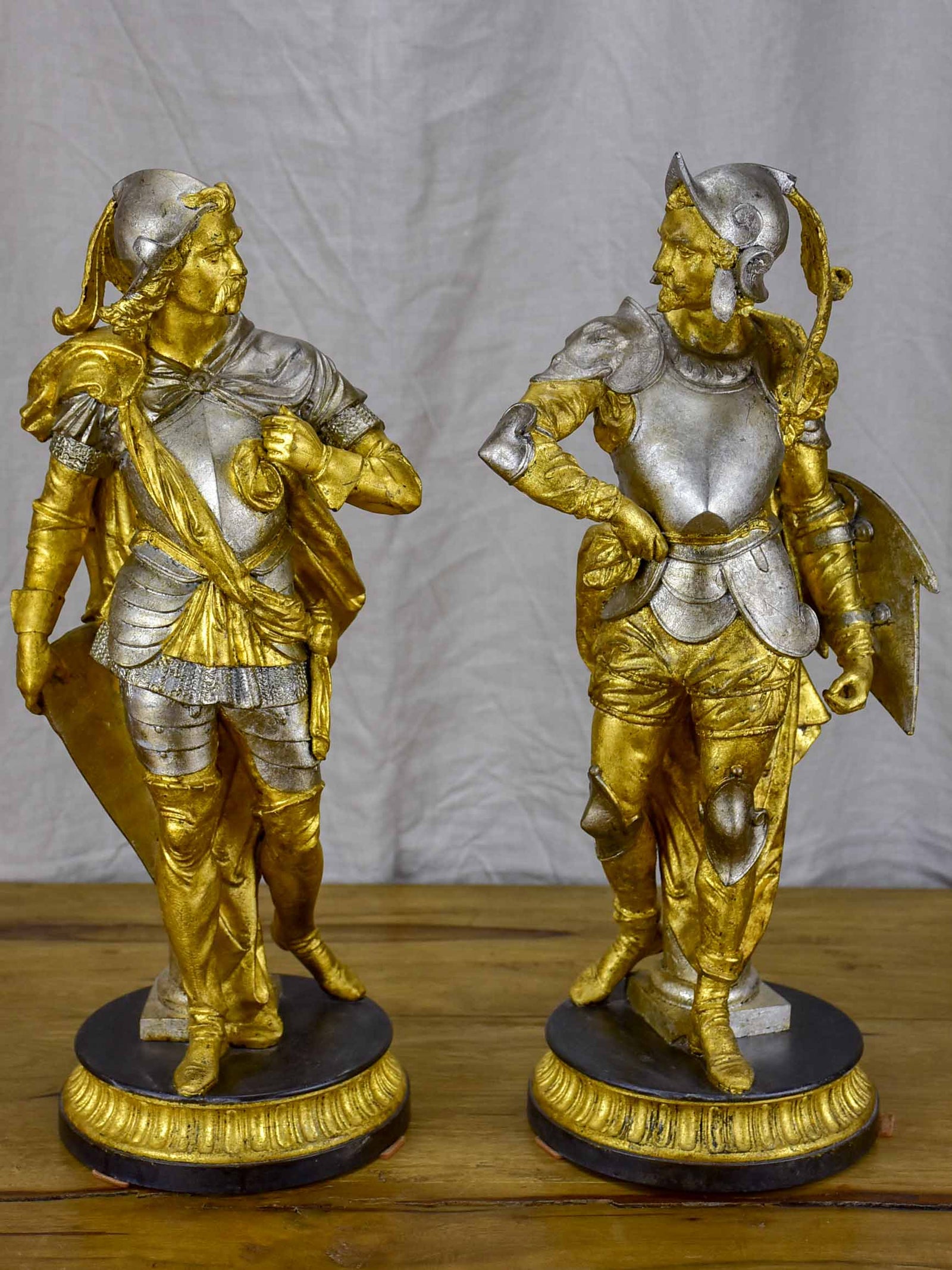 Pair of late 19th Century silver and gold statues