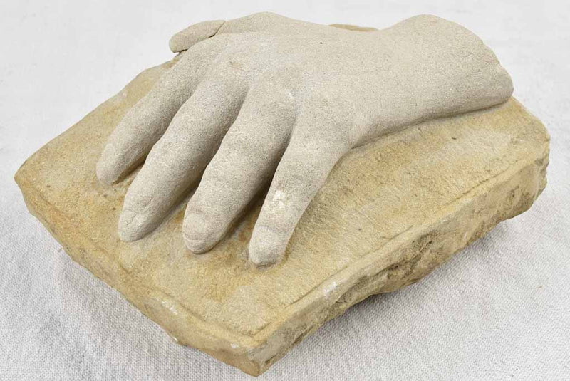 Antique stone sculpture of a hand – Chez Pluie