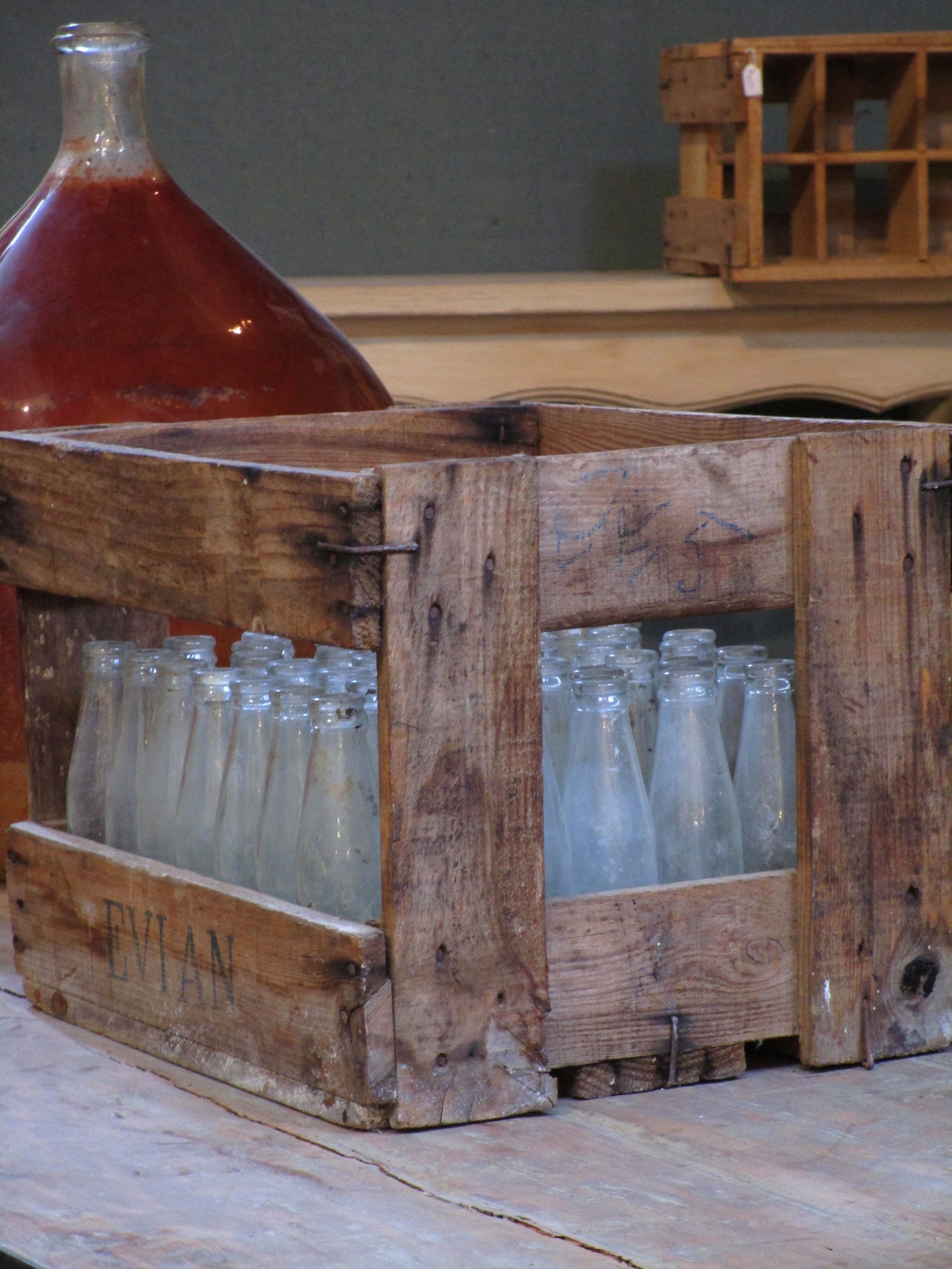 Vintage juice bottles in a rustic wooden box – Chez Pluie